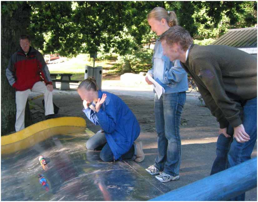 Balls rolling down a playground slide: What factors influence their ...
