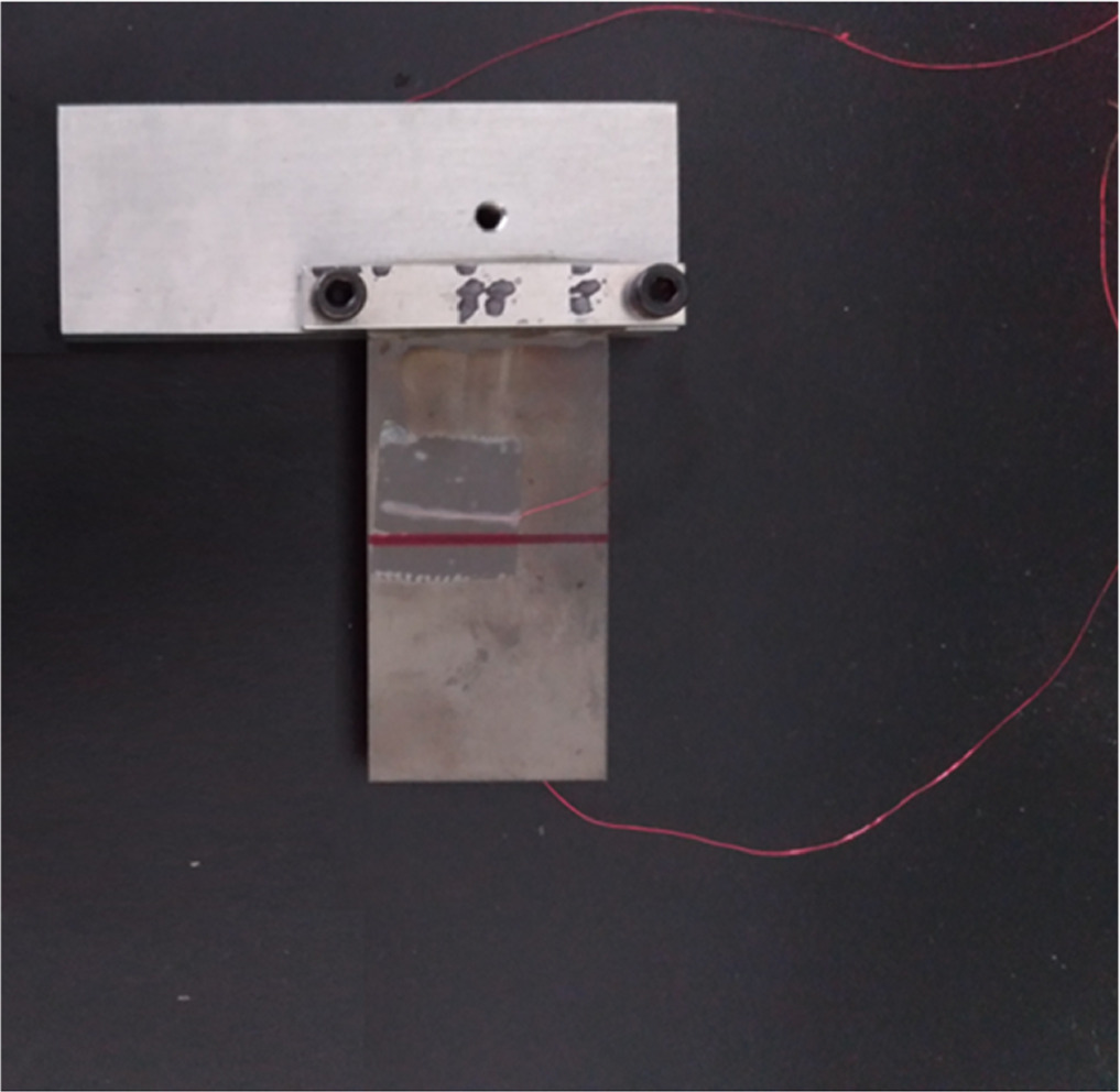 Resonant frequency reduction of piezoelectric vibration energy ...