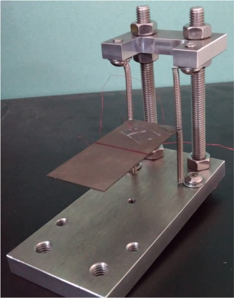Resonant frequency reduction of piezoelectric vibration energy ...
